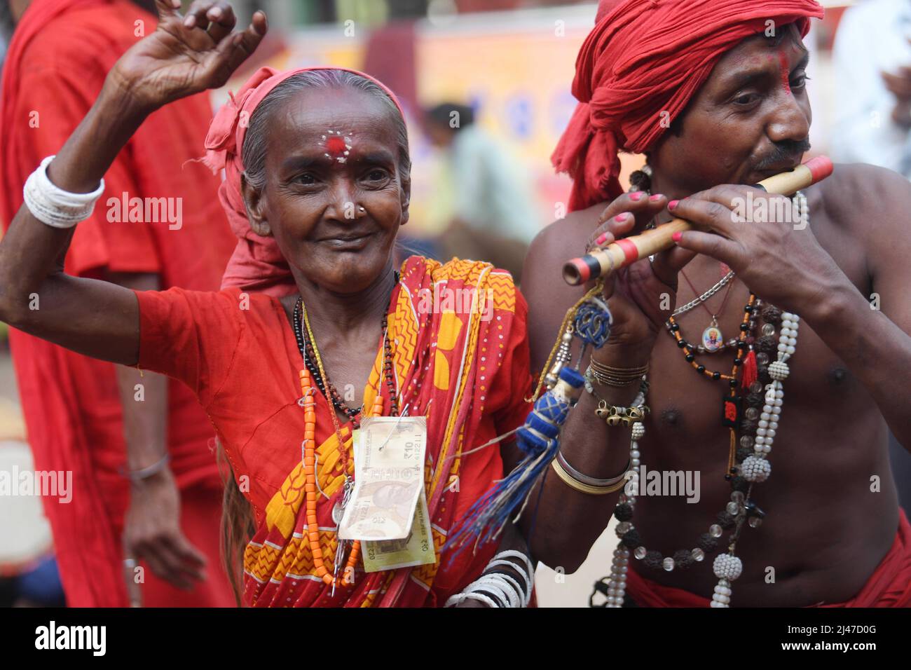 Holy people dancing to a different folk music at the temple during ...