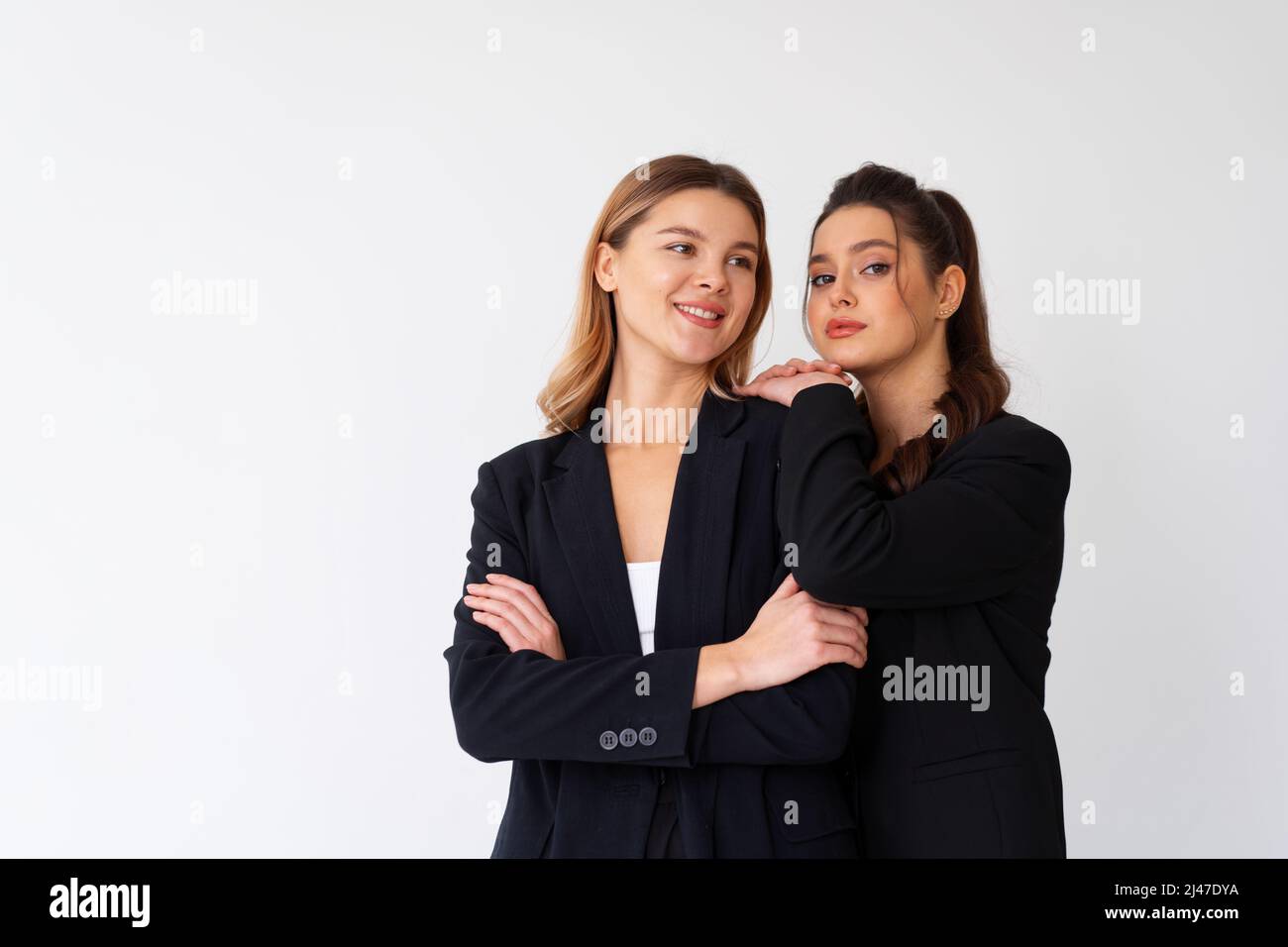 Concept of partnership in business. Two Young businesswoman dressed ...