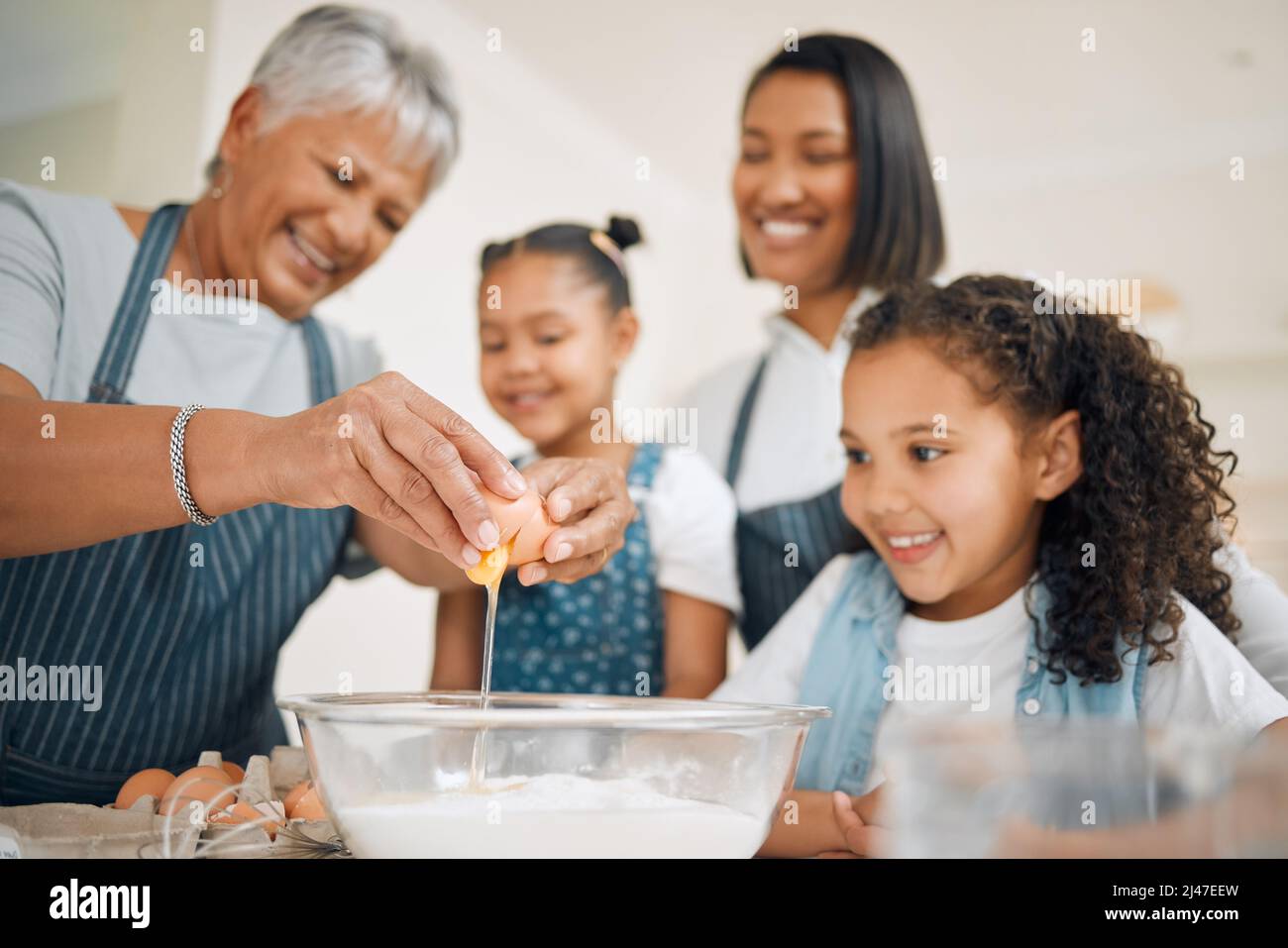 The eggs make it extra fluffy. Shot of a multi-generational family ...