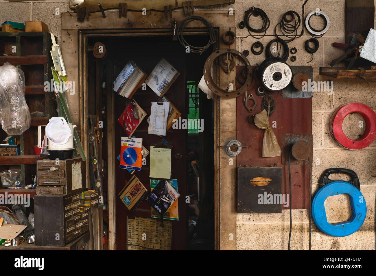 Old Tool Shed with Objects hanging from Wall Stock Photo - Alamy