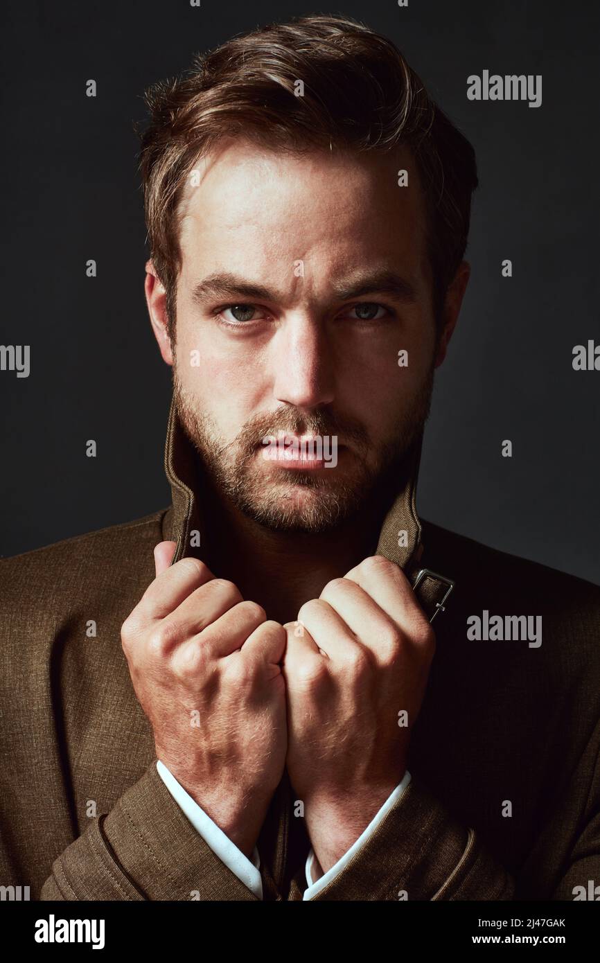 As solid as style gets. Studio portrait of a handsome young man posing ...