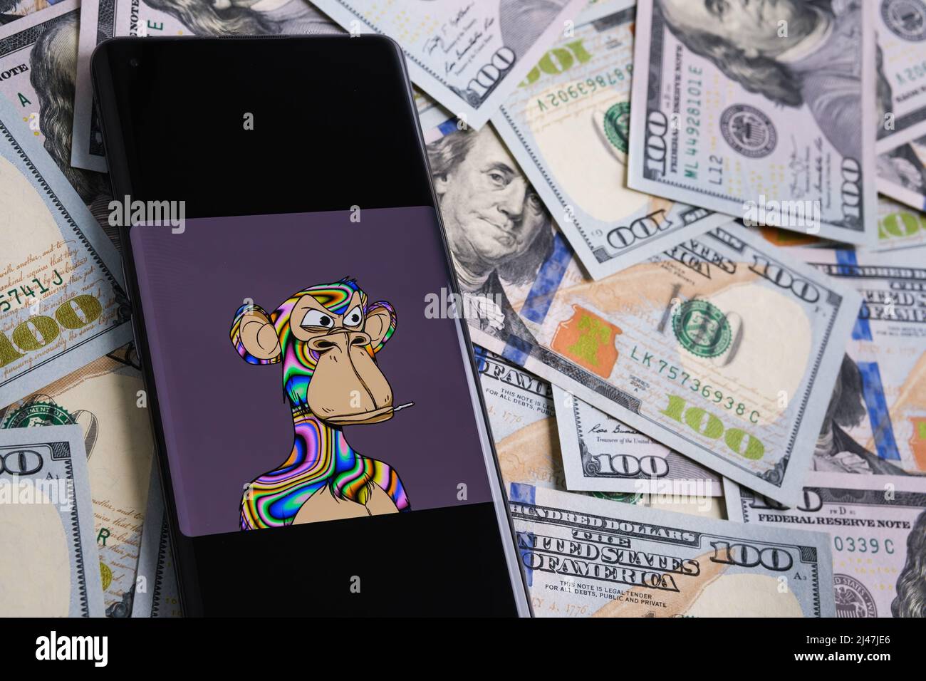 BORED APE 2087 NFT digital art seen on smartphone placed on dollars ...