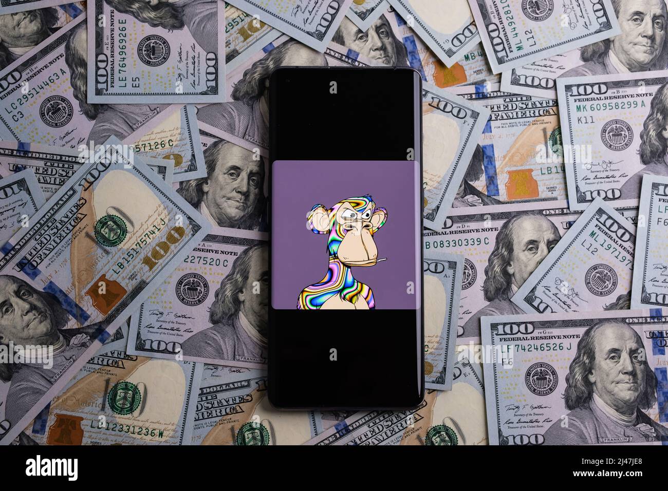 BORED APE 2087 NFT digital art seen on smartphone placed on dollars ...