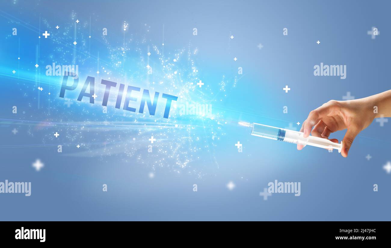 Syringe, medical injection in hand Stock Photo - Alamy