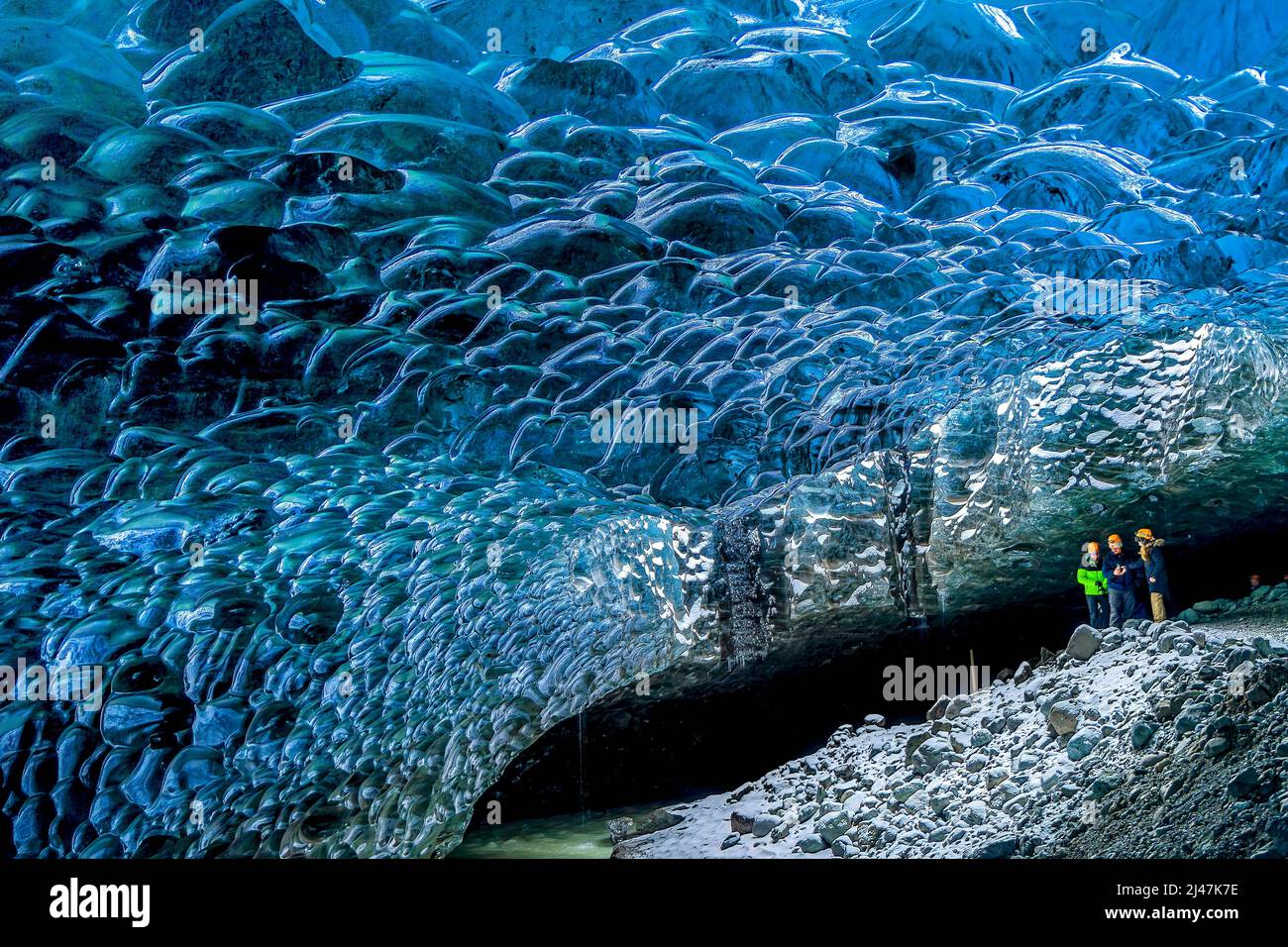 Spectacular blue ice formations inside an ice cave under the ...