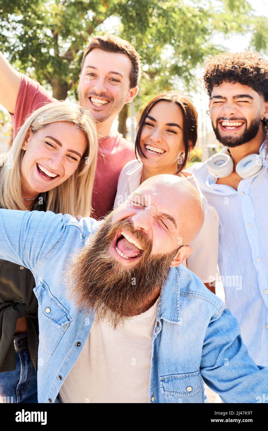 Vertical photo of a group of friends having fun. Friendship and ...