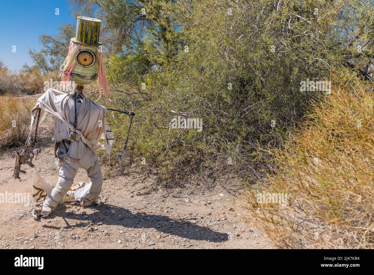 Freakish creature sculpture with one large, orange eye, multicolored ...