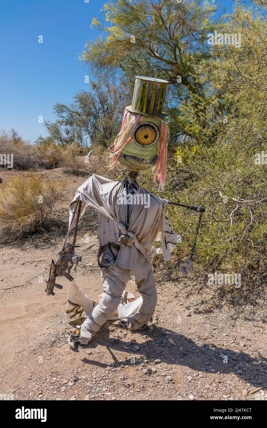Freakish creature sculpture with one large, orange eye, multicolored ...