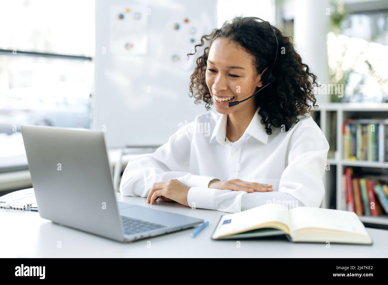 Friendly african american young woman, hotline operator, support ...
