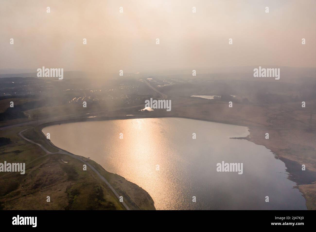 Aerial view of a huge wildfire on higher level moorland next to a ...
