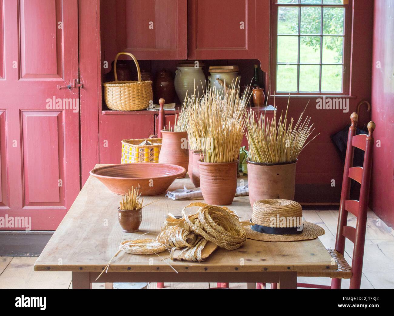 Ethereal still life-work bench of a colonial hat maker with tools and ...