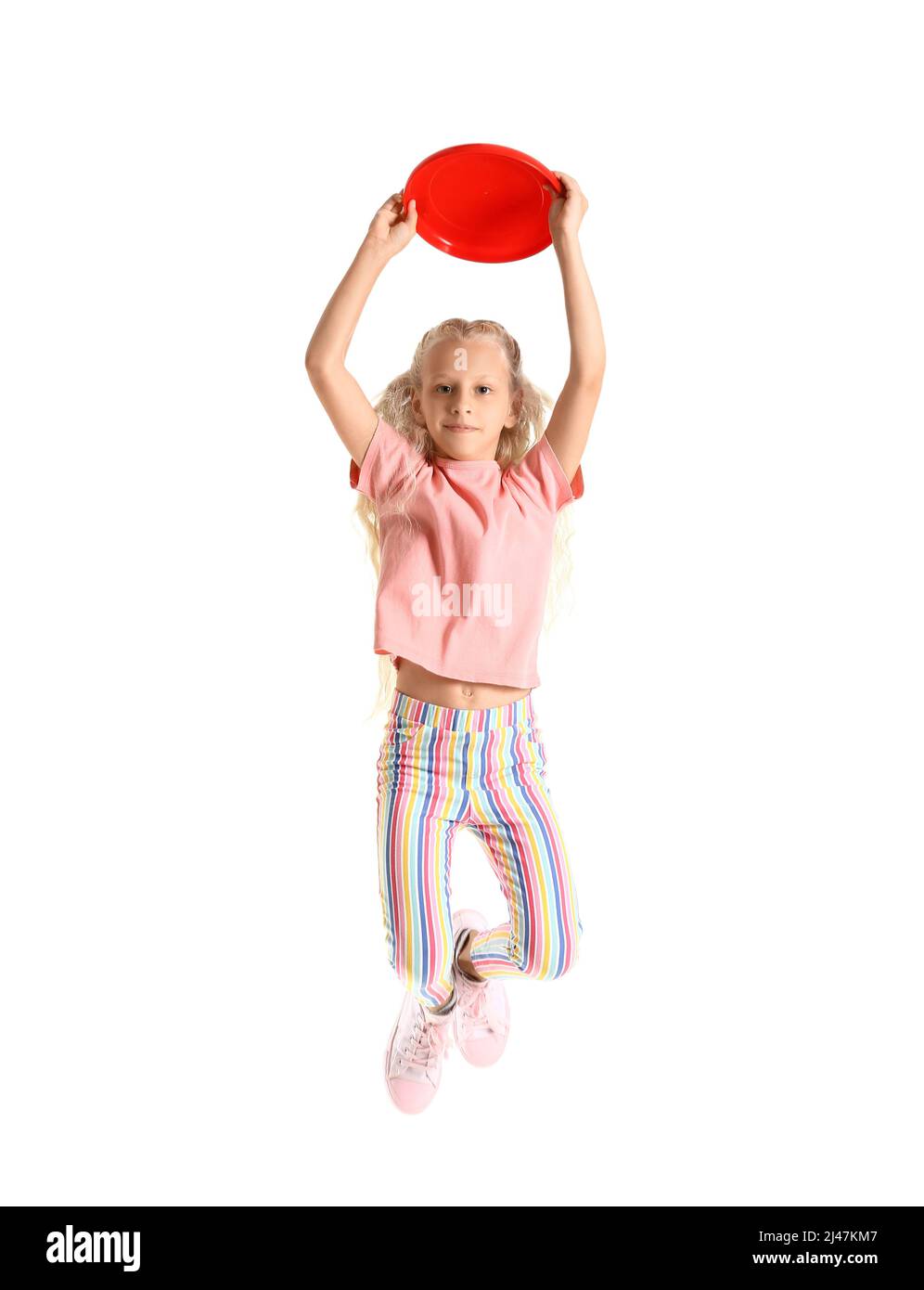 Funny little girl playing frisbee on white background Stock Photo - Alamy