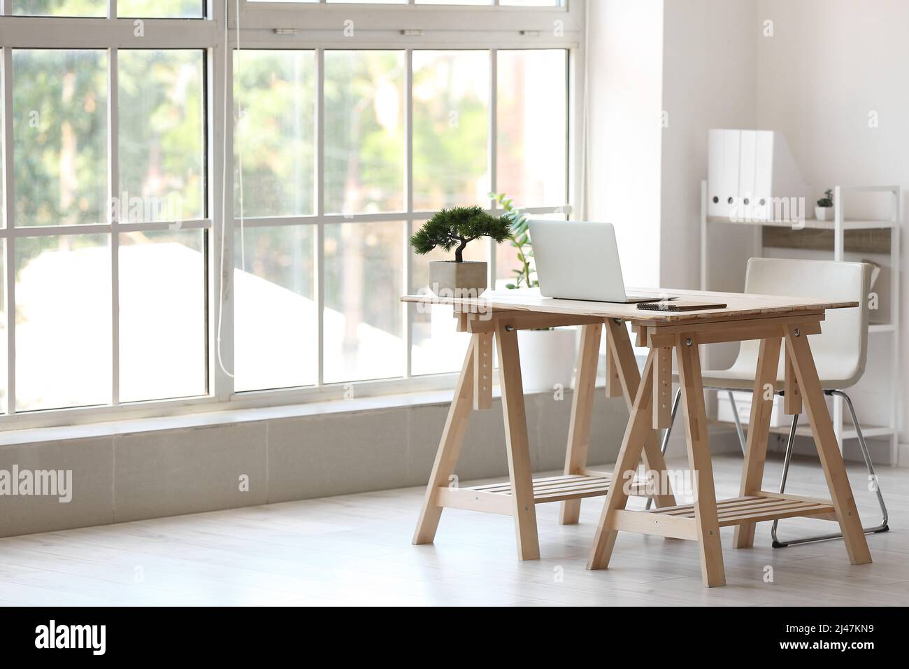 Interior of stylish room with modern workplace Stock Photo - Alamy