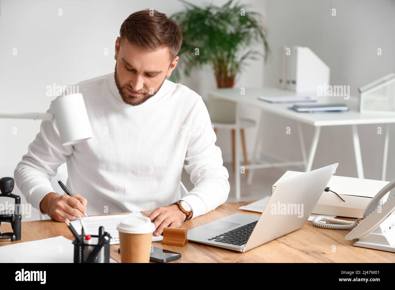 Male notary public working in office Stock Photo - Alamy