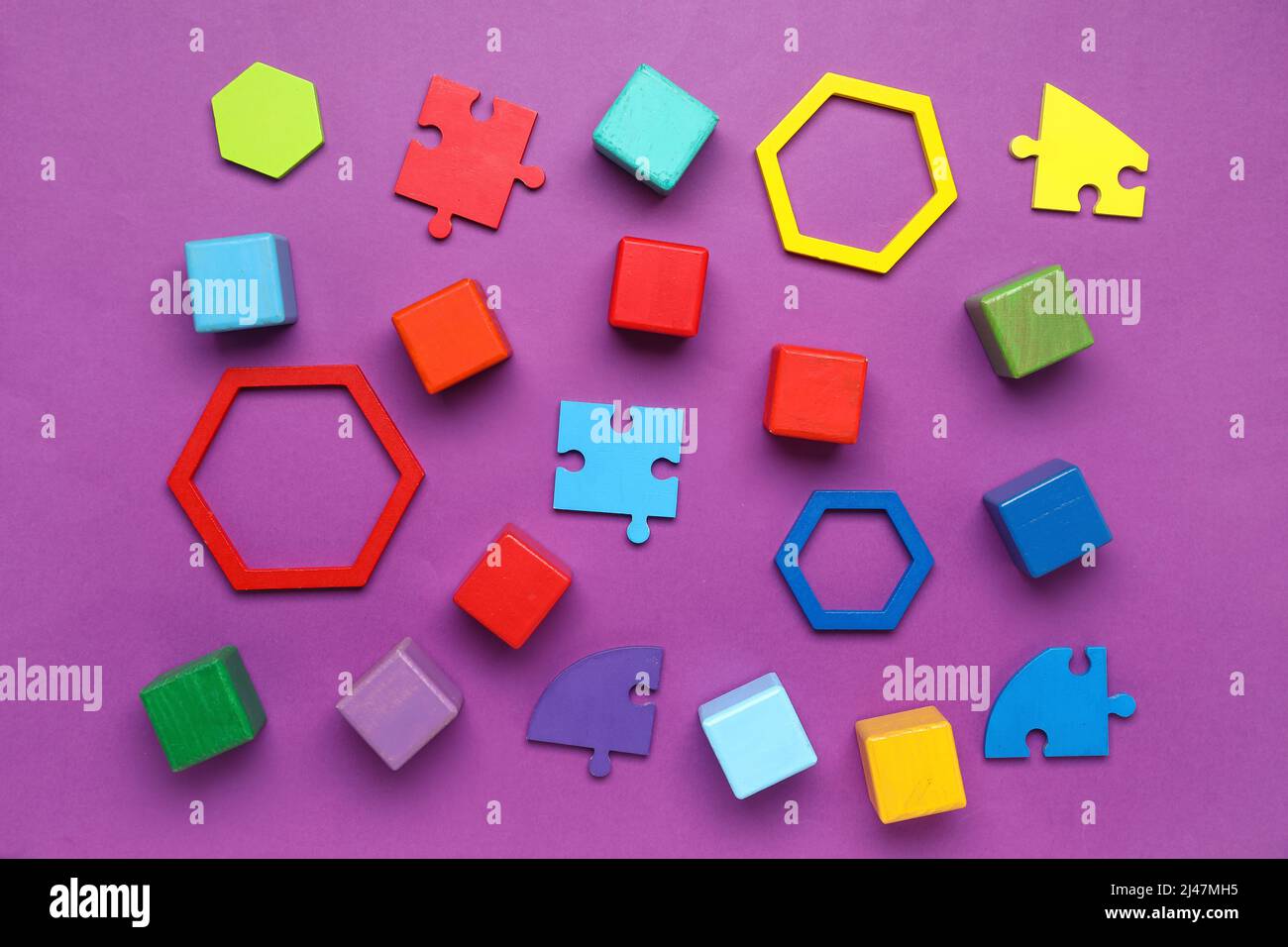 Colorful cubes with blocks and puzzle pieces on purple background Stock ...