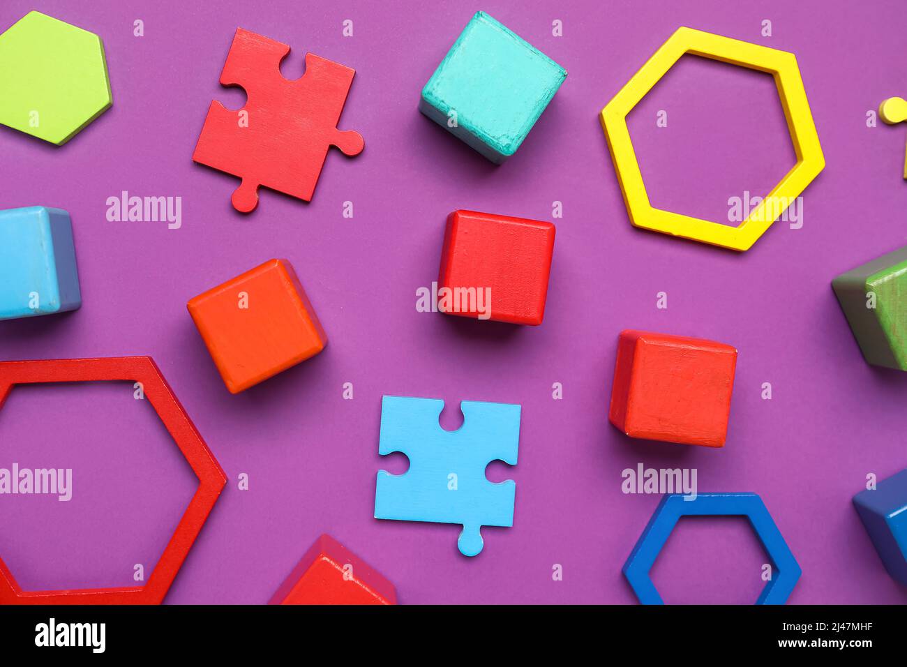 Colorful cubes with blocks and puzzle pieces on purple background Stock ...