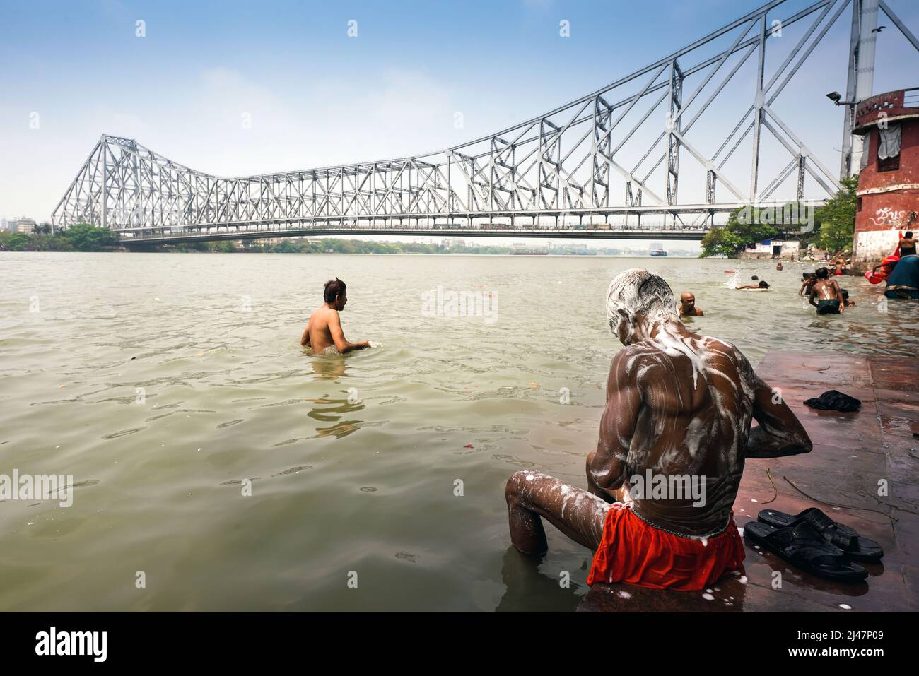 People take a bath in Hooghly River (mouth of the Ganges river) near ...