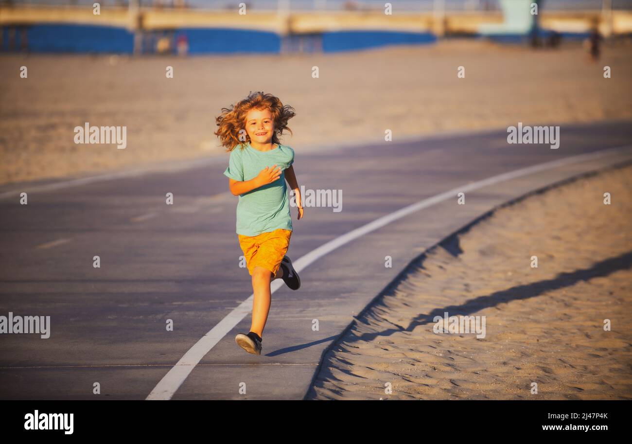 Cheerful child boy running to school. Kids run race Stock Photo - Alamy