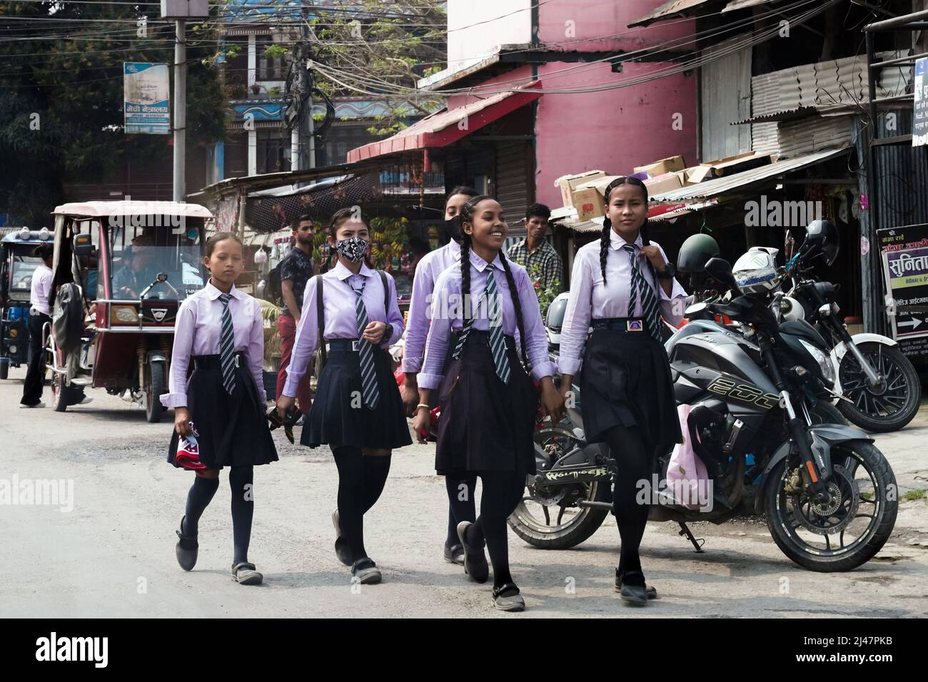 Schoolgirls in their school uniforms in the border town of Kakarvitta ...