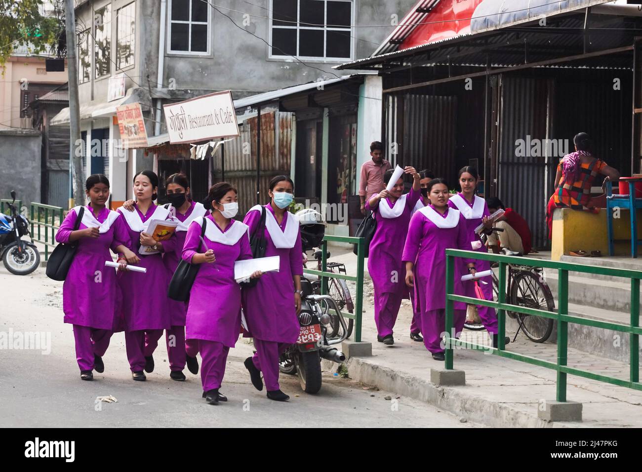 Female students in their school uniforms in the border town of ...