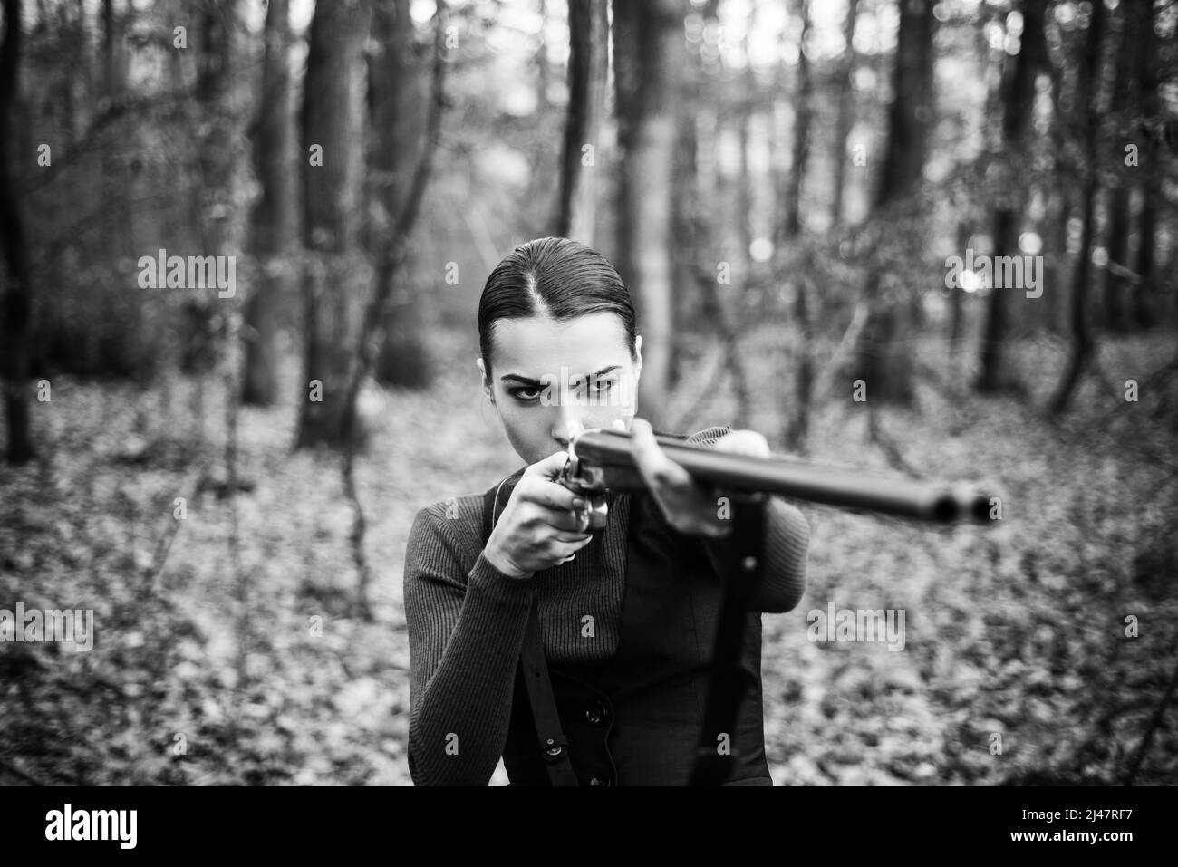 Hunter woman with shotgun on hunt. Hunting in forest. Portrait of woman ...