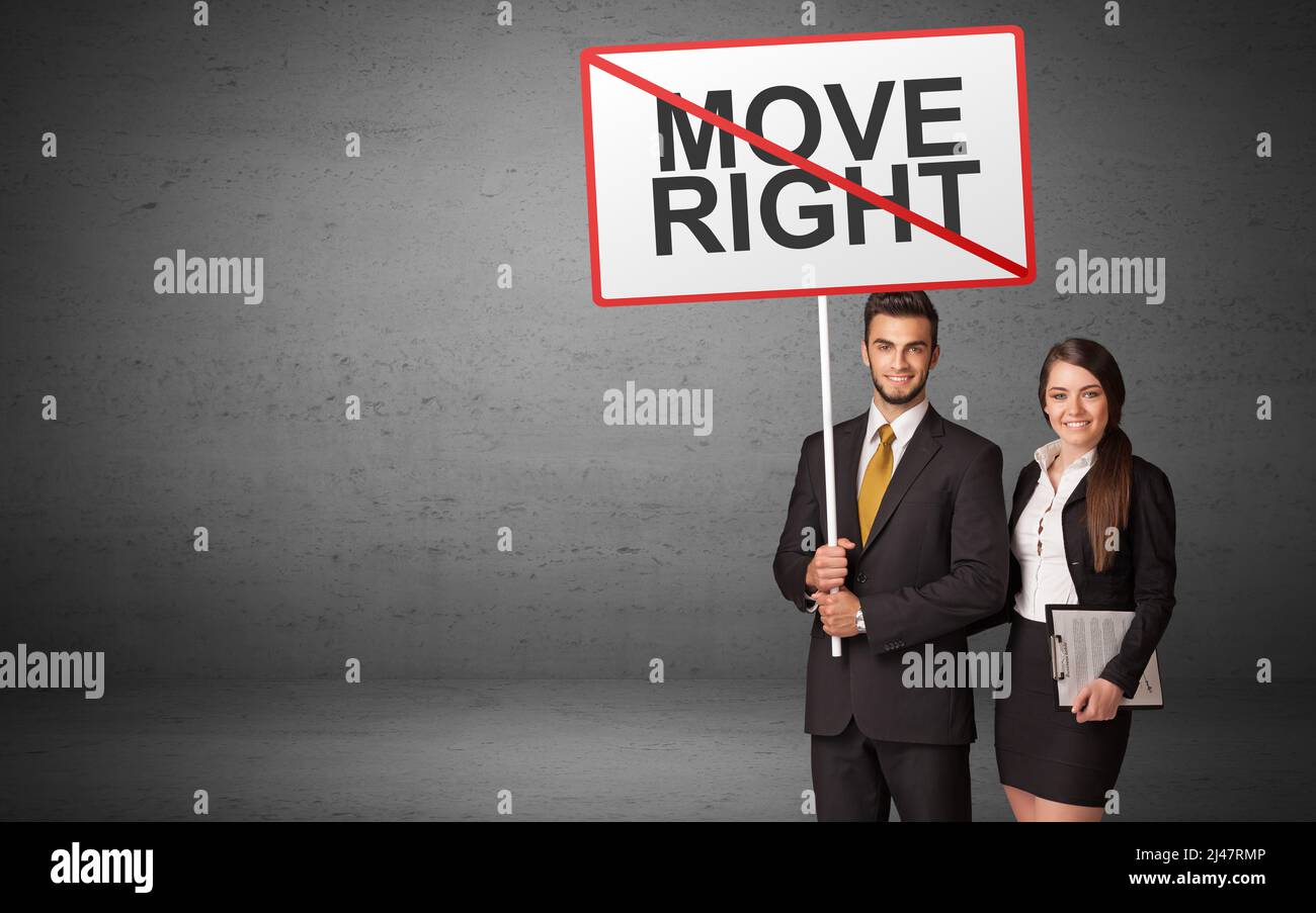 business person holding a traffic sign Stock Photo - Alamy