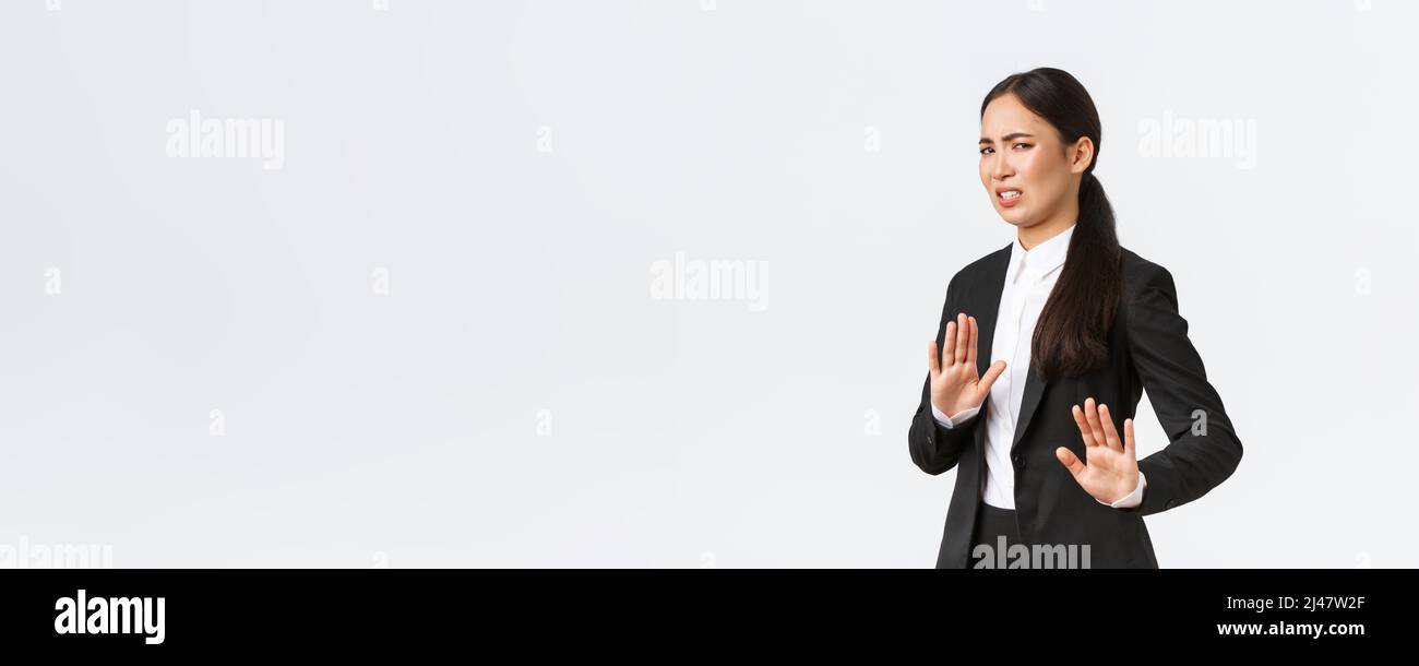 Displeased asian businesswoman avoiding risky suggestions, shaking ...