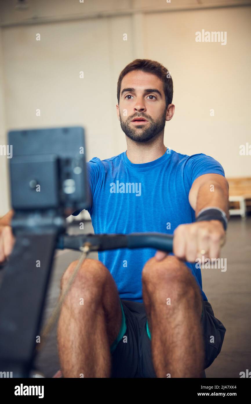 Male on rowing machine hi-res stock photography and images - Alamy