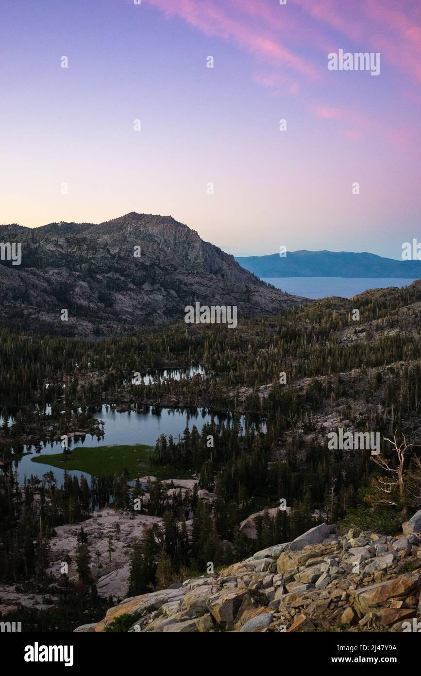 Dusk near the Velma Lakes with Lake Tahoe visible in the distance Stock ...