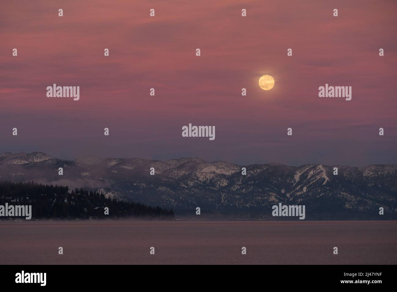Full moon rising over Lake Tahoe in Winter Stock Photo - Alamy