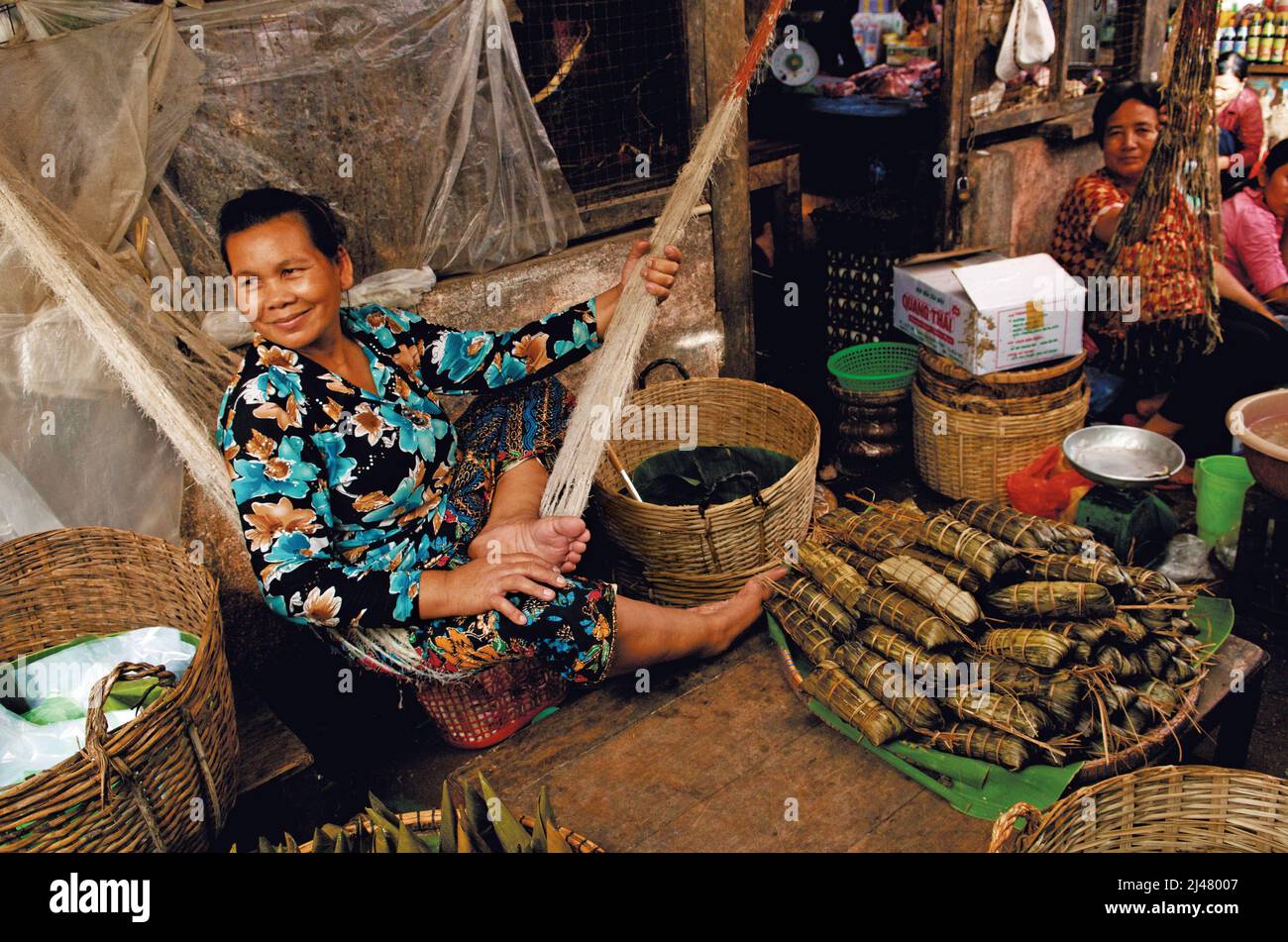 Cambodian woman swings in Hammock, Kampot Market, Kampot, Cambodia ...