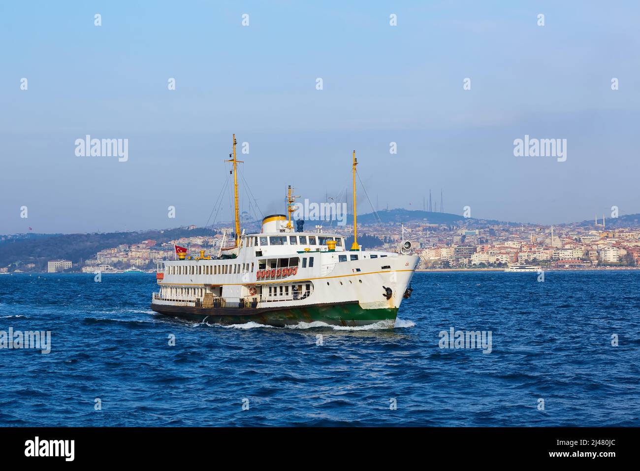 Tourist boat sails on the Golden Horn in Istanbul at sunset, Turkey ...