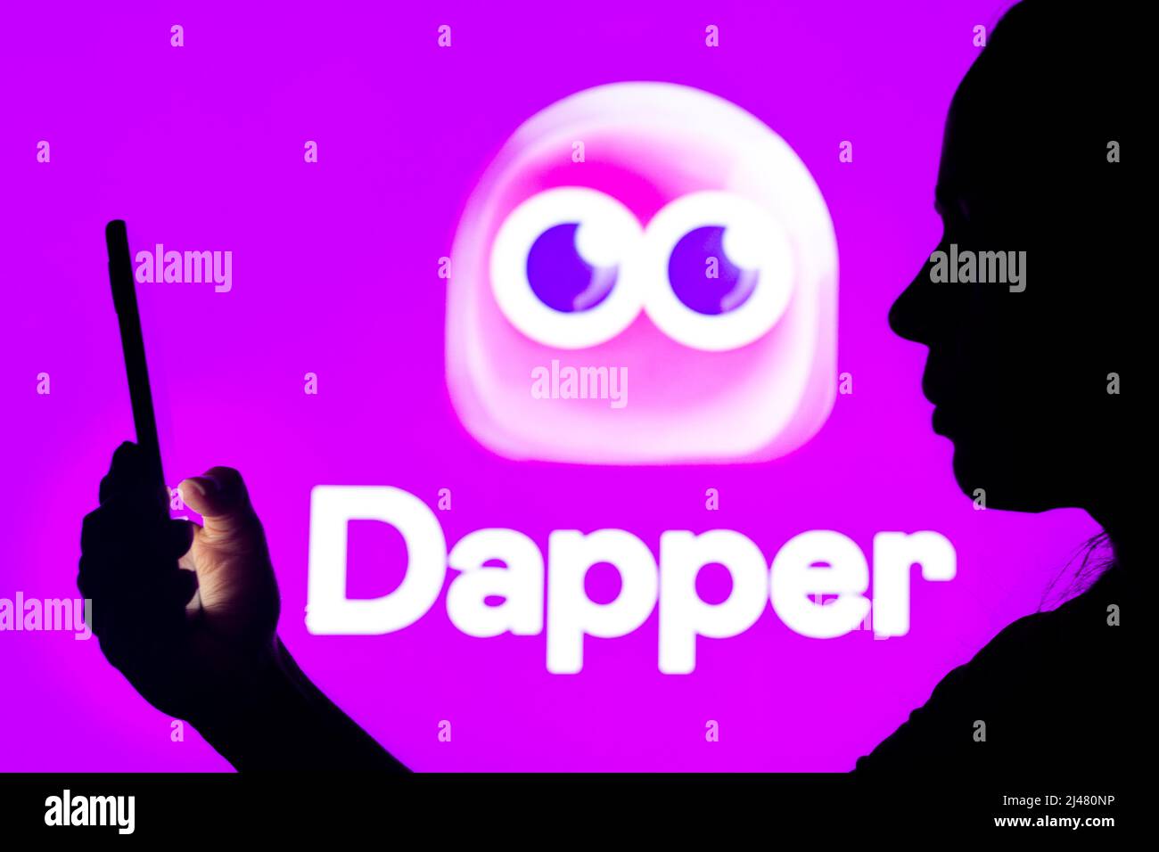 In this photo illustration, a woman's silhouette holds a smartphone ...