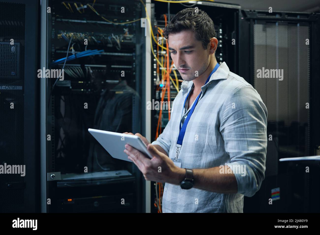 Checking the network status. Cropped shot of a handsome young male ...
