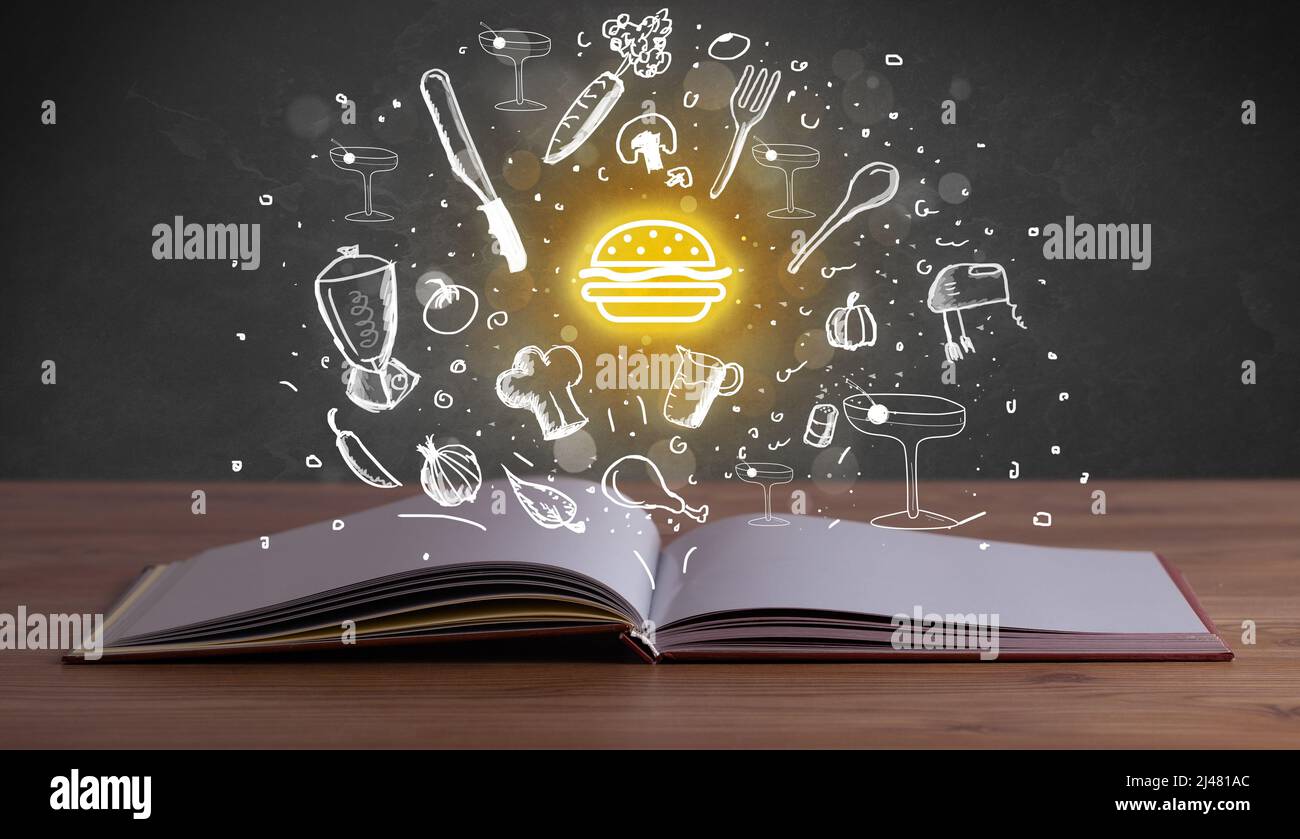 Open recipe book with food related icons above Stock Photo - Alamy