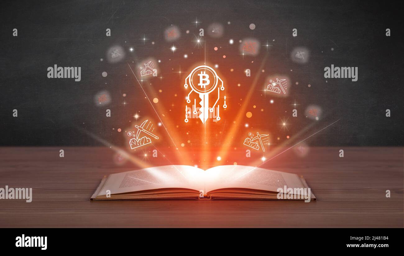 Open book with currency icons above Stock Photo - Alamy