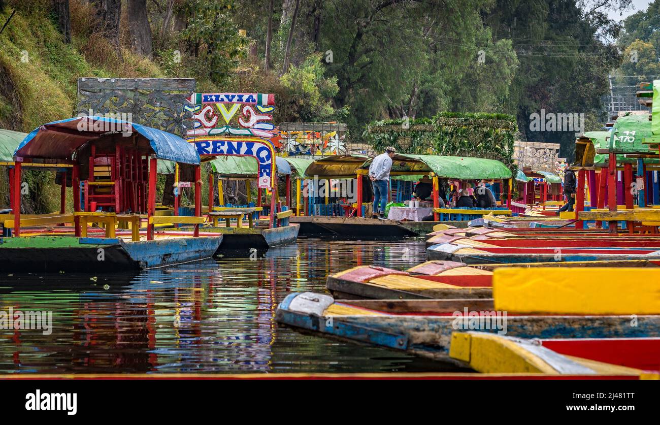 MEXICO CITY - Dec 19, 2021. Colorful boats parked on a canal in ...