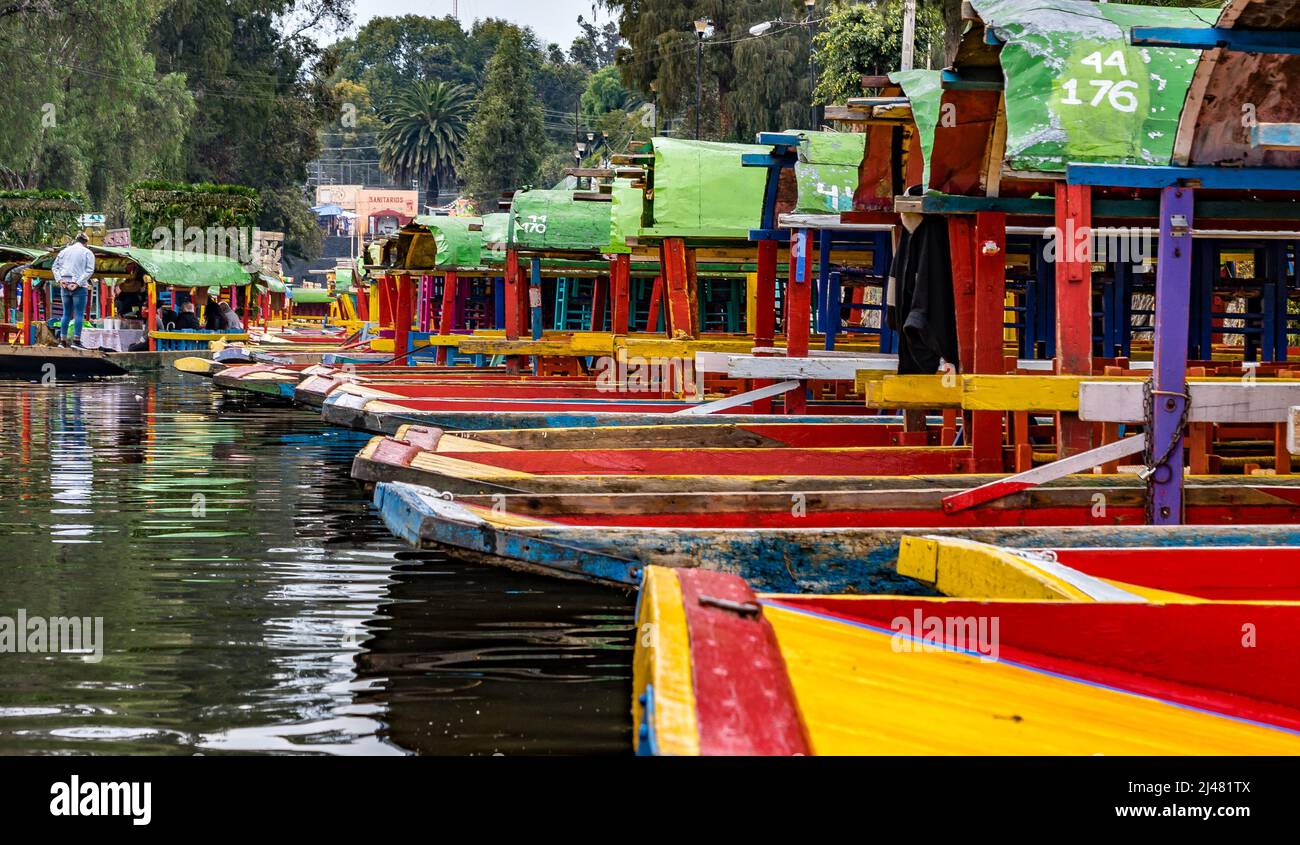 MEXICO CITY - Dec 19, 2021. Colorful boats parked on a canal in ...