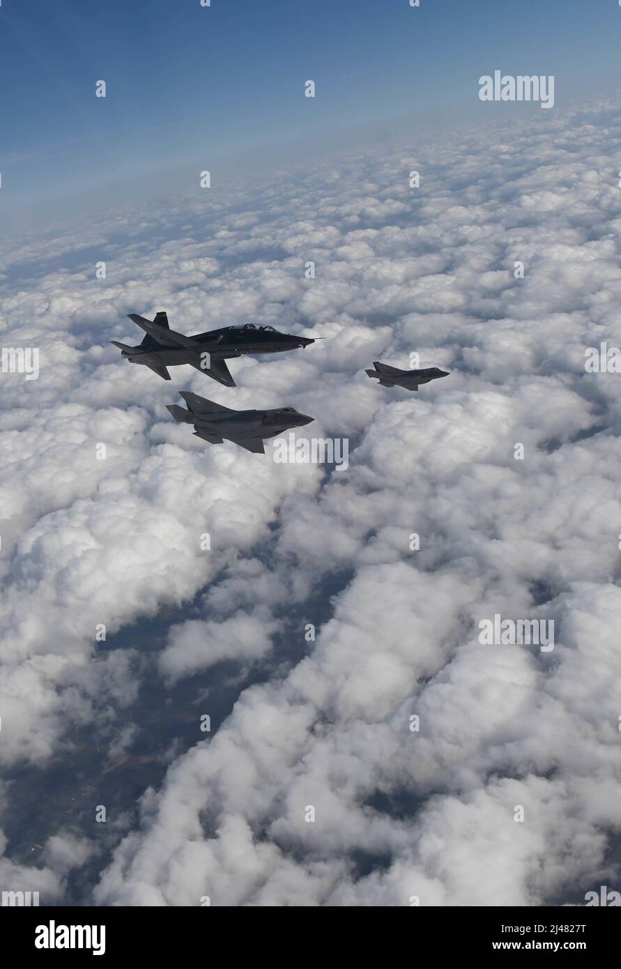 U.S. Air Force T-38 Talon and two F-35 Lightning II's fly over Whiteman ...