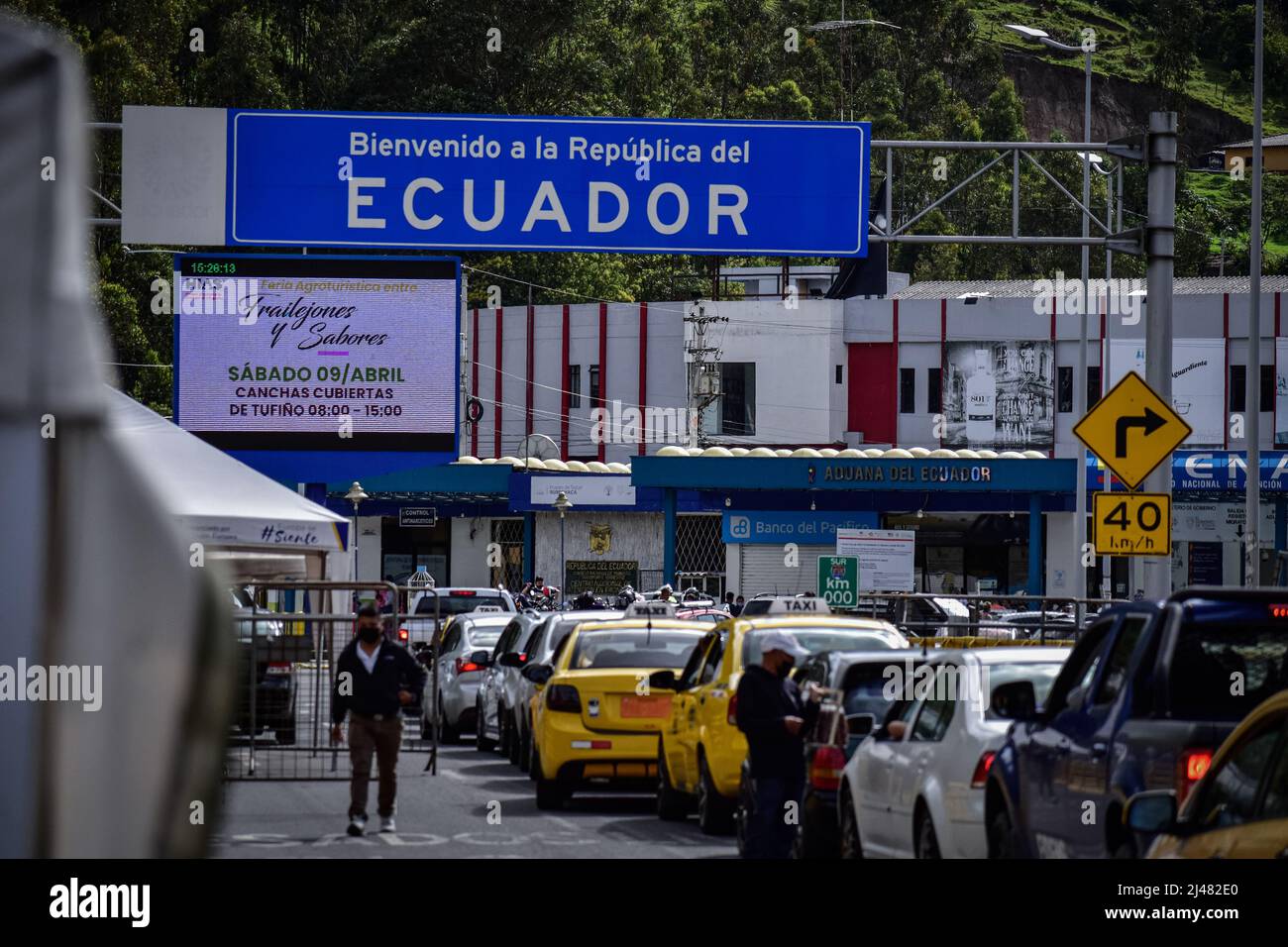 Lines of vehicles are seen crossing the Ecuador - Colombia border at ...