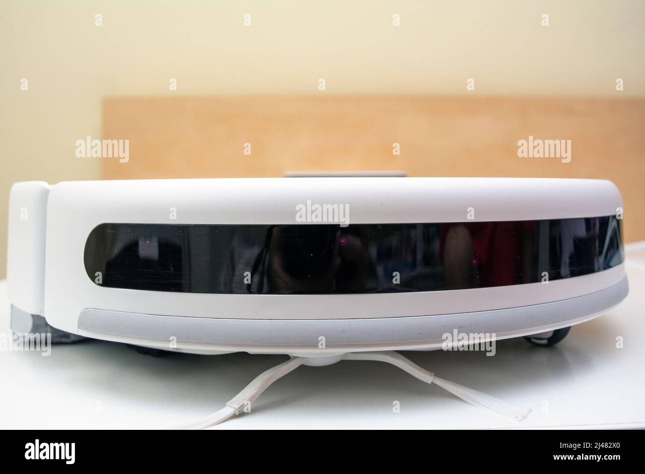 The front design of an automatic robot vaacuum cleaner Stock Photo - Alamy