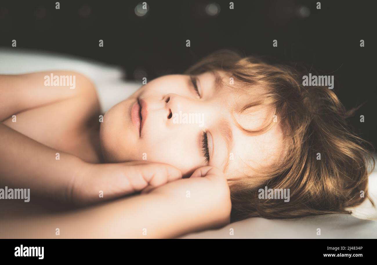 Kids in pajamas sleeping on bed on white background. Bed time Stock ...