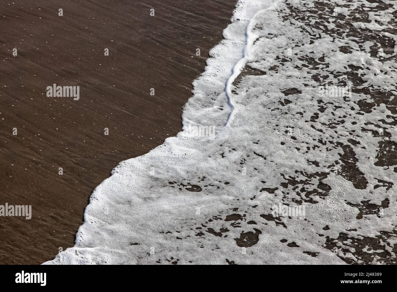 Ocean waves on the sand. Natural background Stock Photo - Alamy