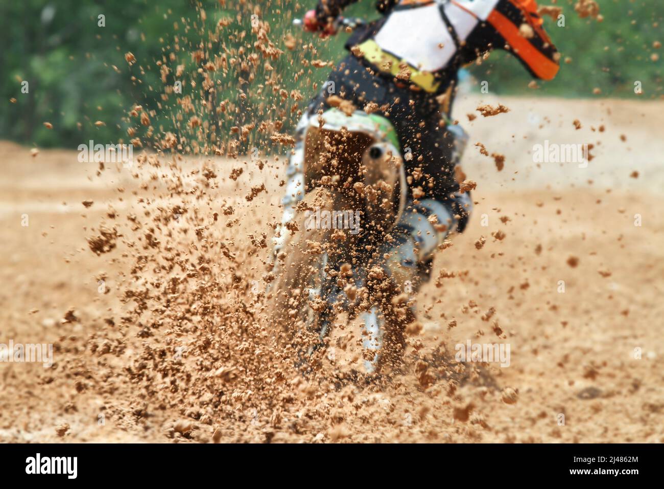 Mud debris flying from a motocross race Stock Photo - Alamy