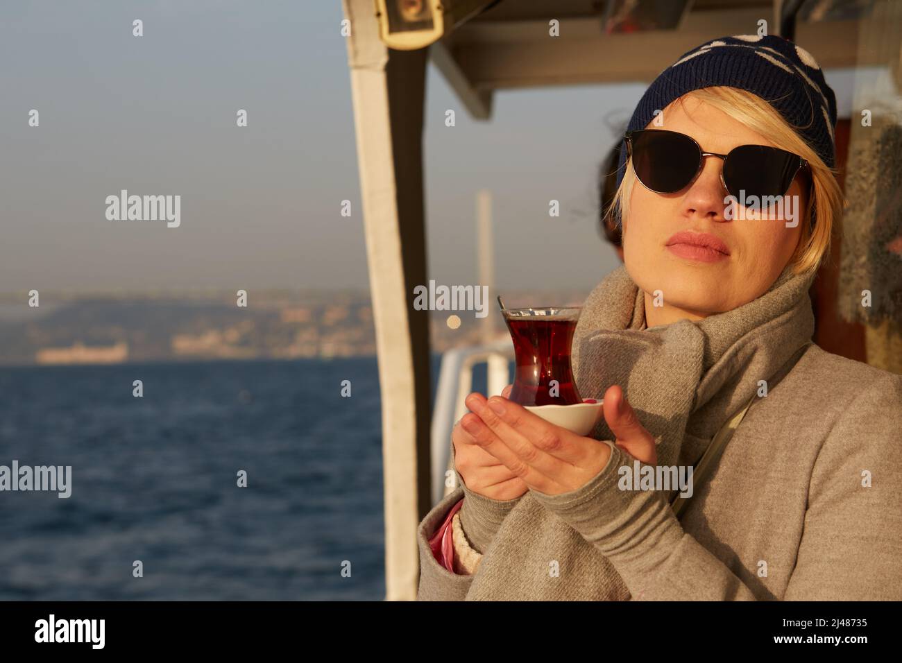 Young woman drinking traditional Turkish tea Stock Photo - Alamy