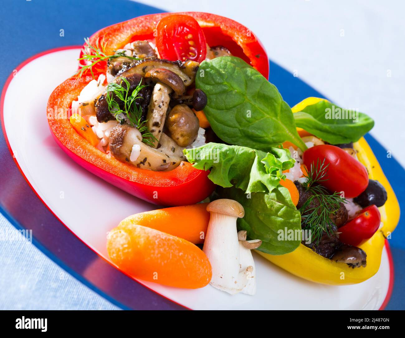 Delicious stuffed peppers with mushrooms, rice, sesame and vegetables ...