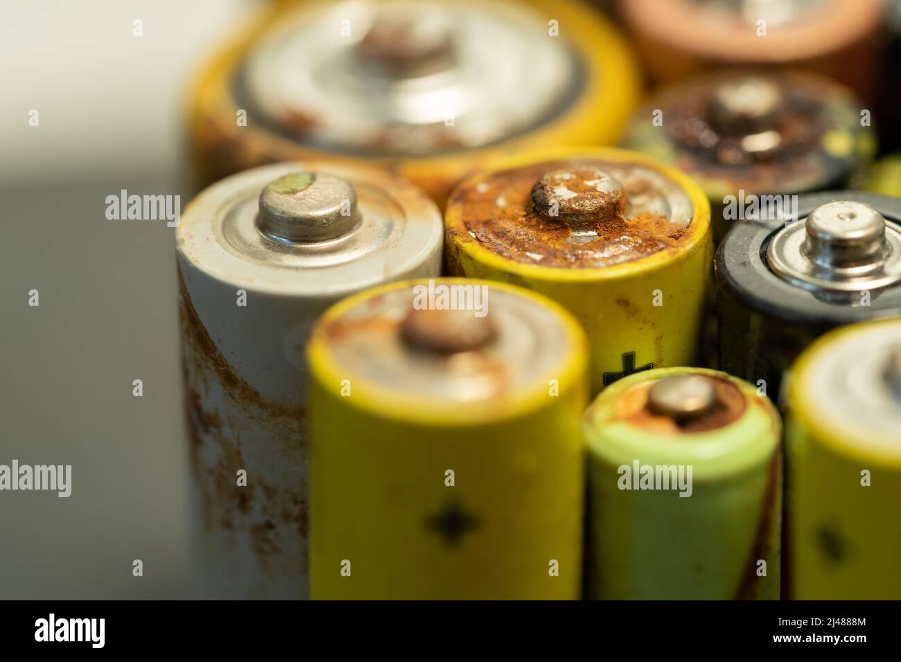 Closeup of used battery with traces of rust and corrosion. Electronic ...