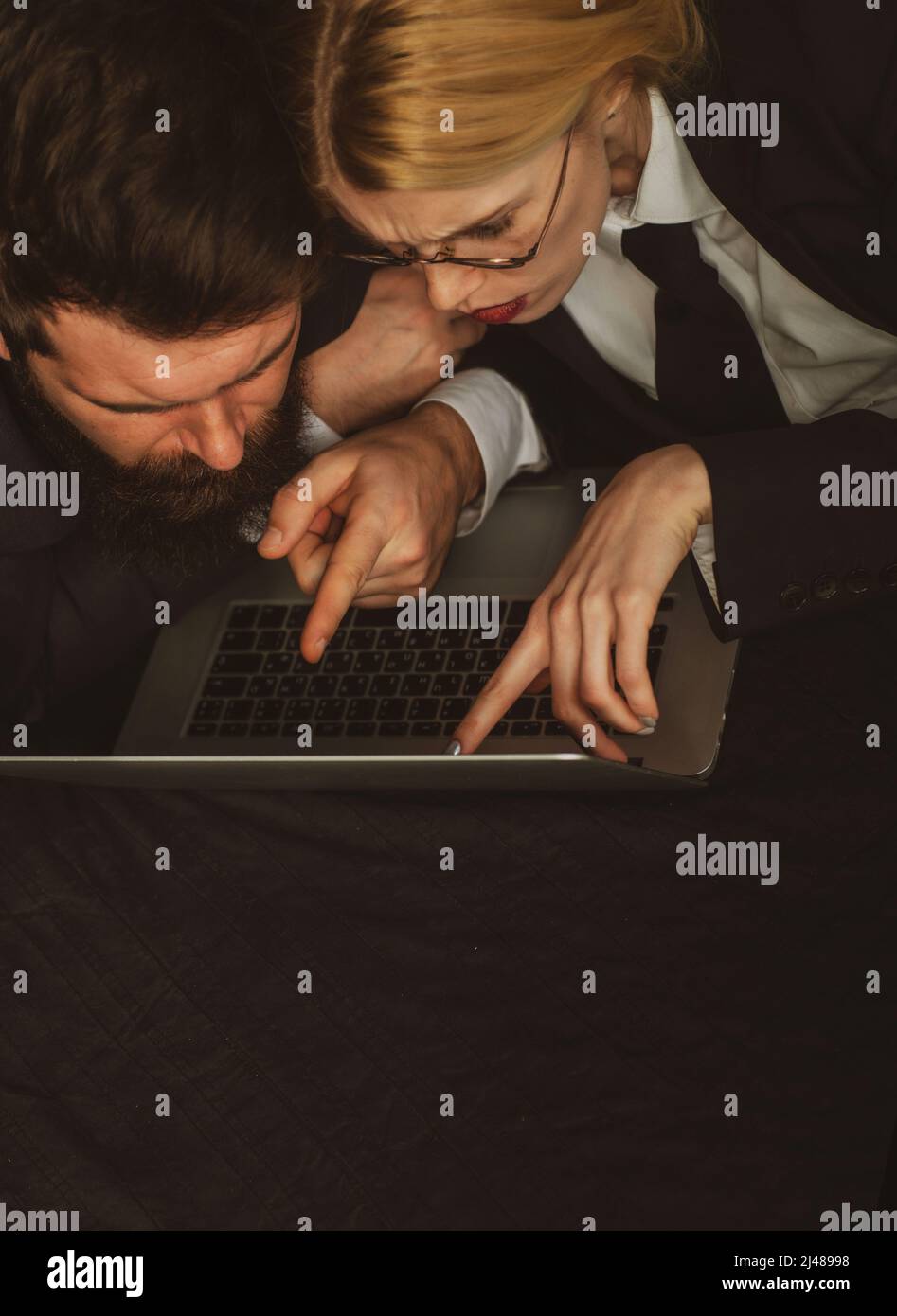 Business concept. Portrait of a interesting business couple looking at ...