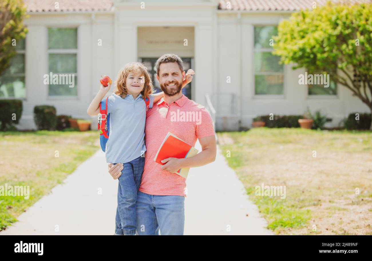 Father and son run with father after come back from school. School ...