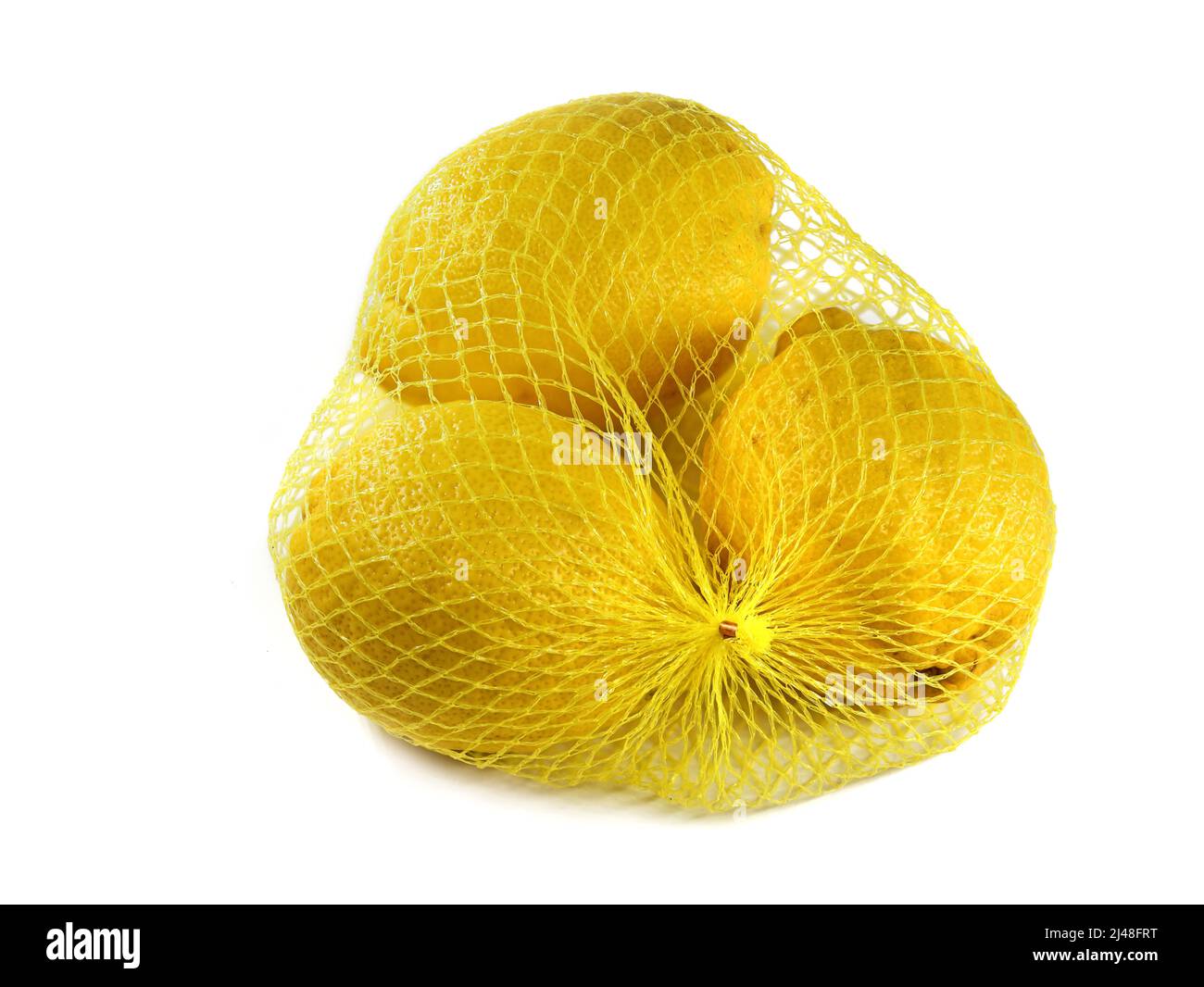 fresh lemons in a yellow net bag isolated on white background Stock ...